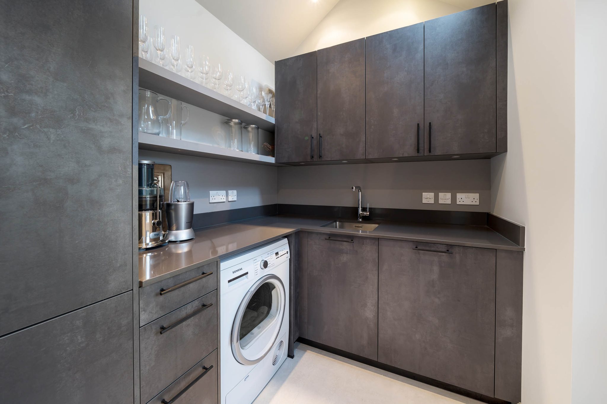An Elegant Modern Asymmetrical Kitchen and Utility Room