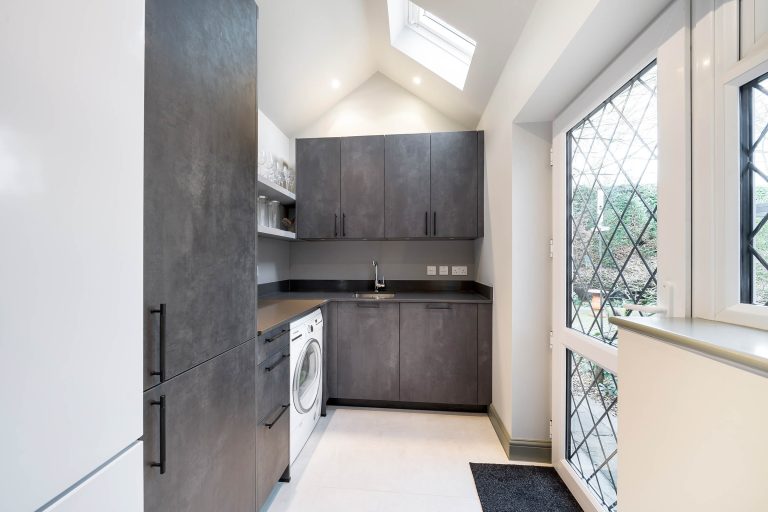 An Elegant Modern Asymmetrical Kitchen and Utility Room