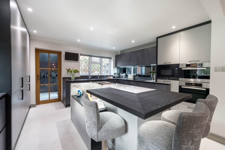 An Elegant Modern Asymmetrical Kitchen and Utility Room